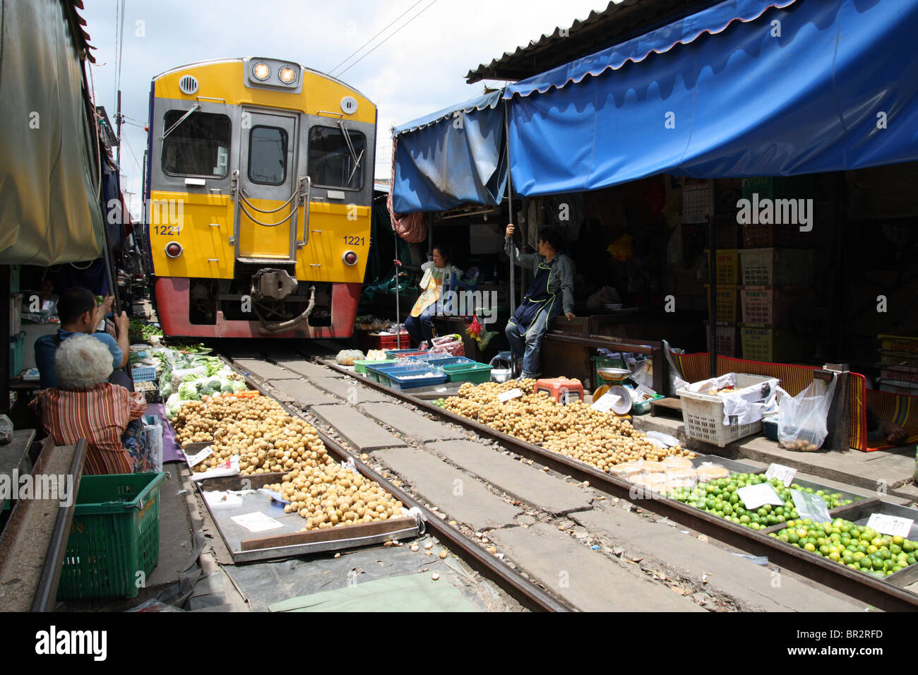 A food market on the rail tracks , Maeklong railway market , Thailand ...