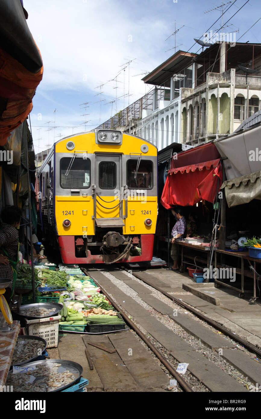 A food market on the rail tracks , Maeklong railway market , Thailand ...