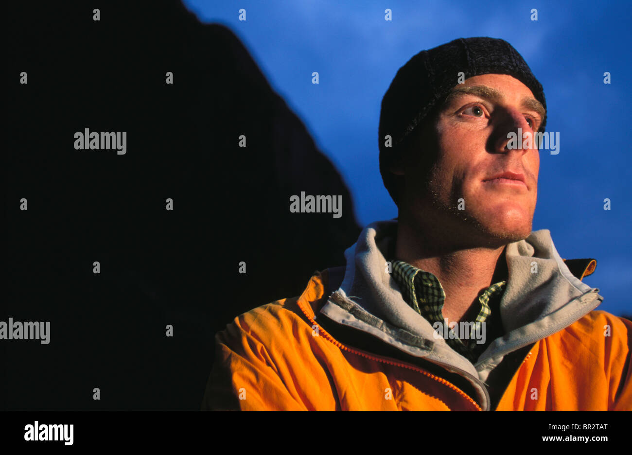 Lit headshot / portrait of a male climber, mountaineer, snowboarder ...
