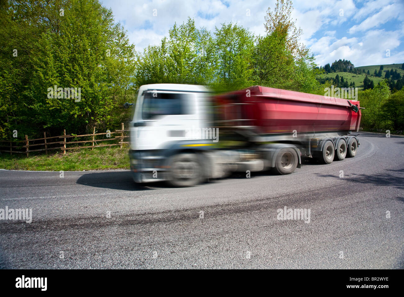 Big truck with trailer speeding on a road, with motion blur Stock Photo ...