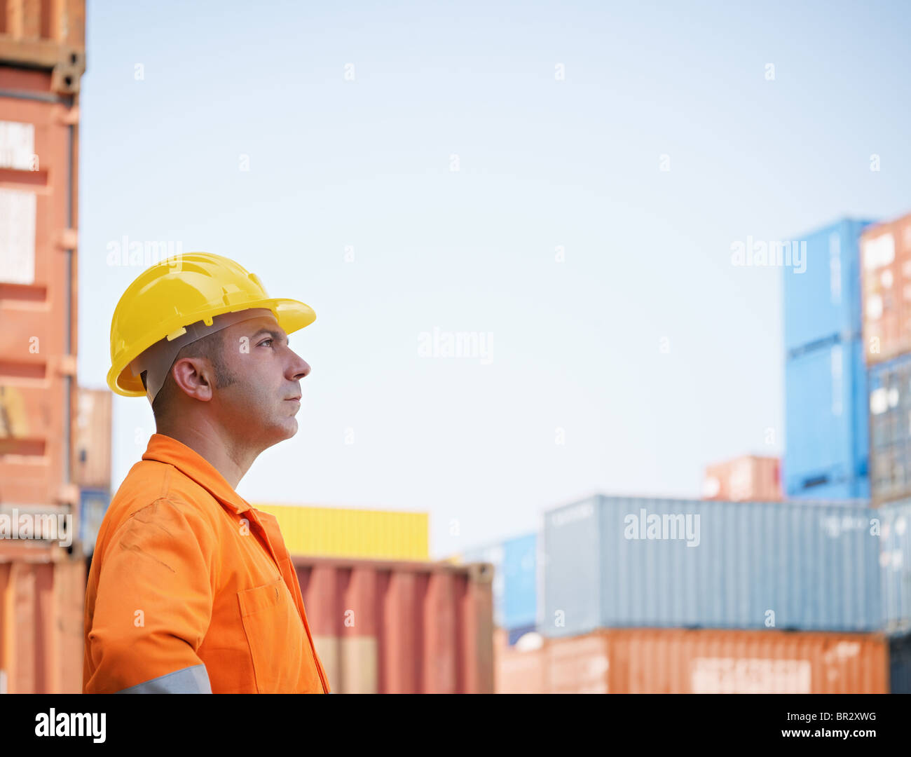 Man looking up at shipping containers hi-res stock photography and ...
