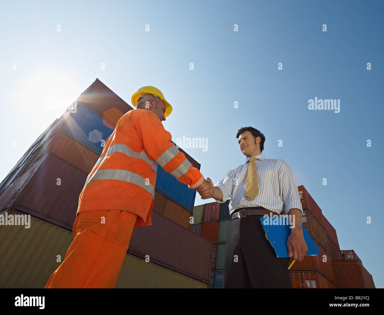 Two workers container shaking hands hi-res stock photography and images ...