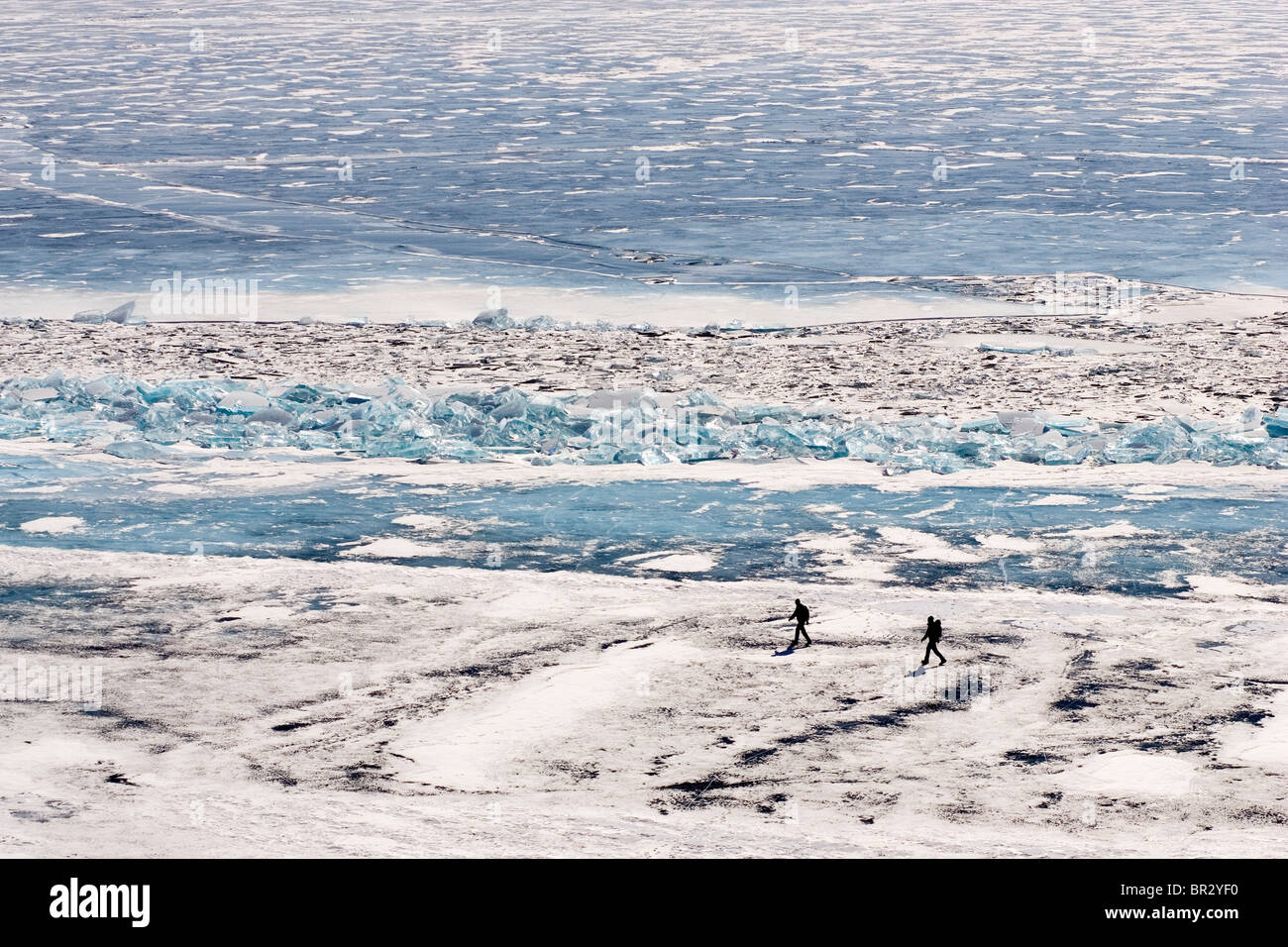 Hikers on the frozen Lake Baikal during the winter in Siberia, Russia ...