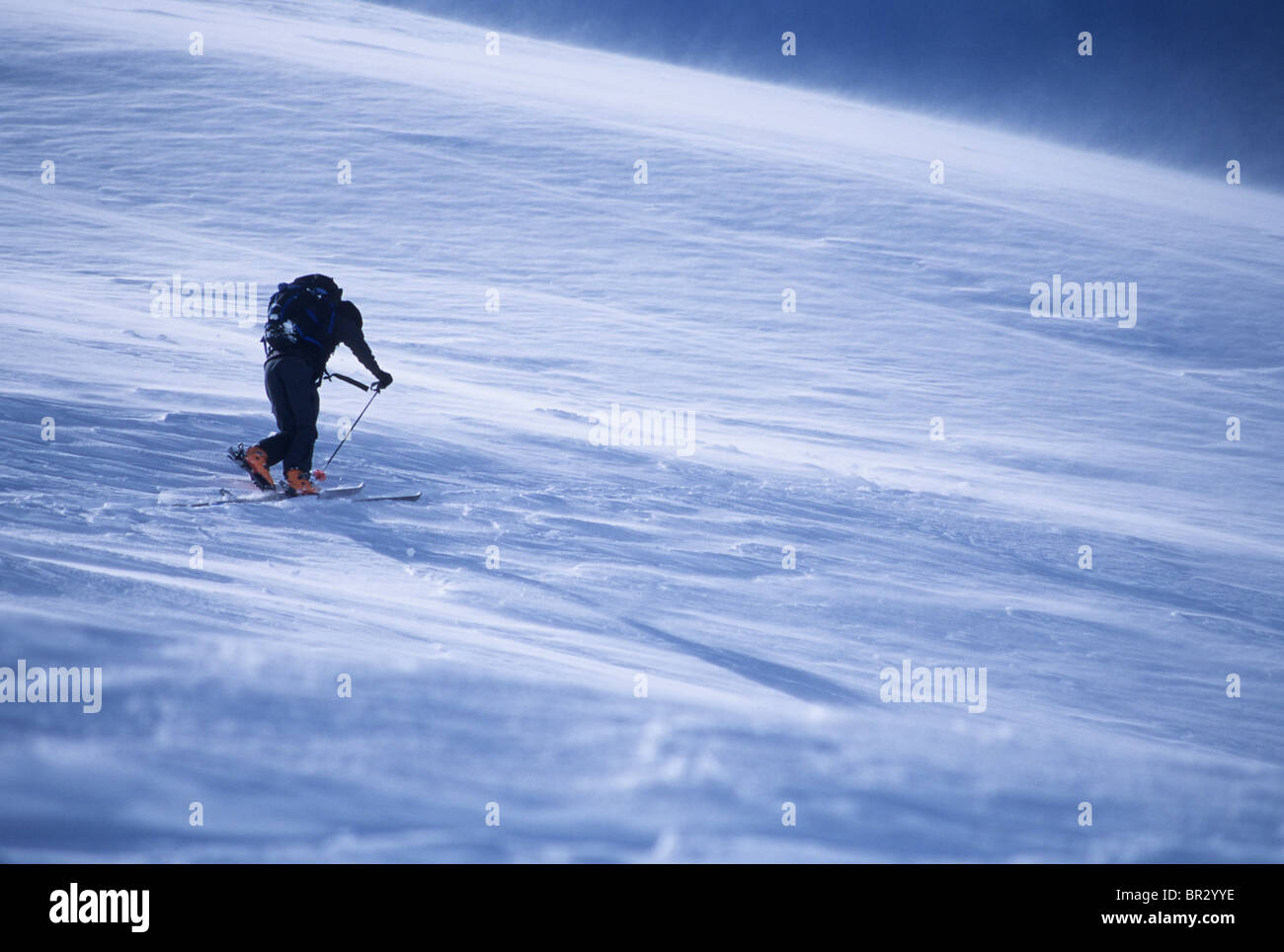 Single backcountry skier ascending slope Stock Photo - Alamy