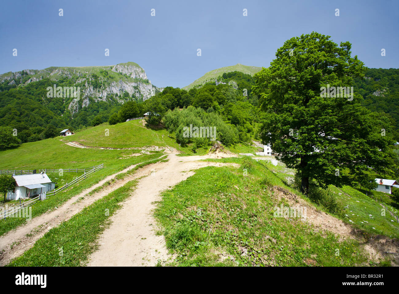 Landscape with village houses on mountains Stock Photo - Alamy