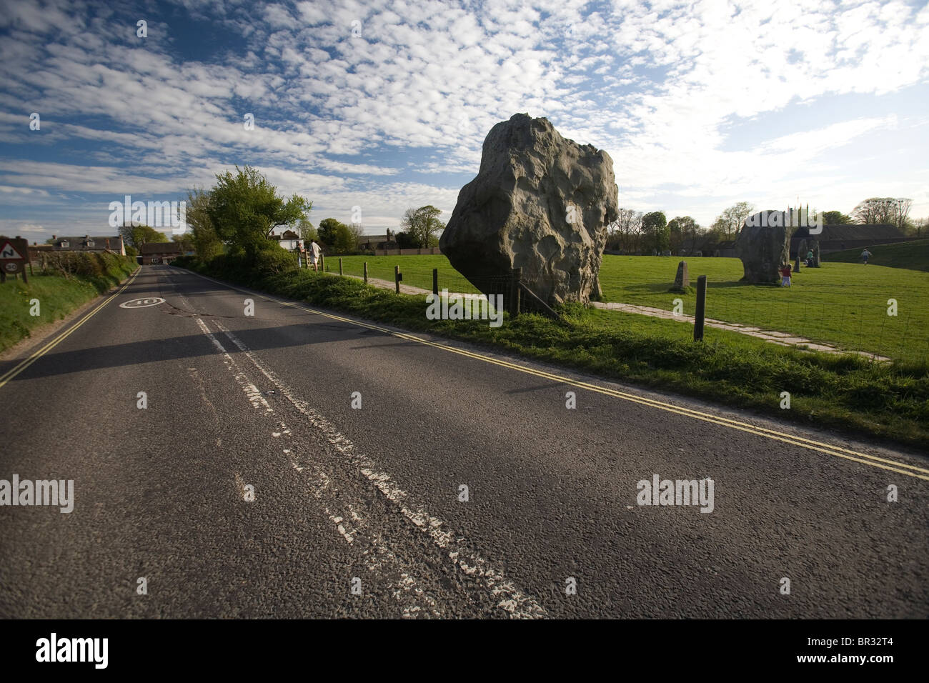 Shadow from large stone block crosses the road Stock Photo - Alamy