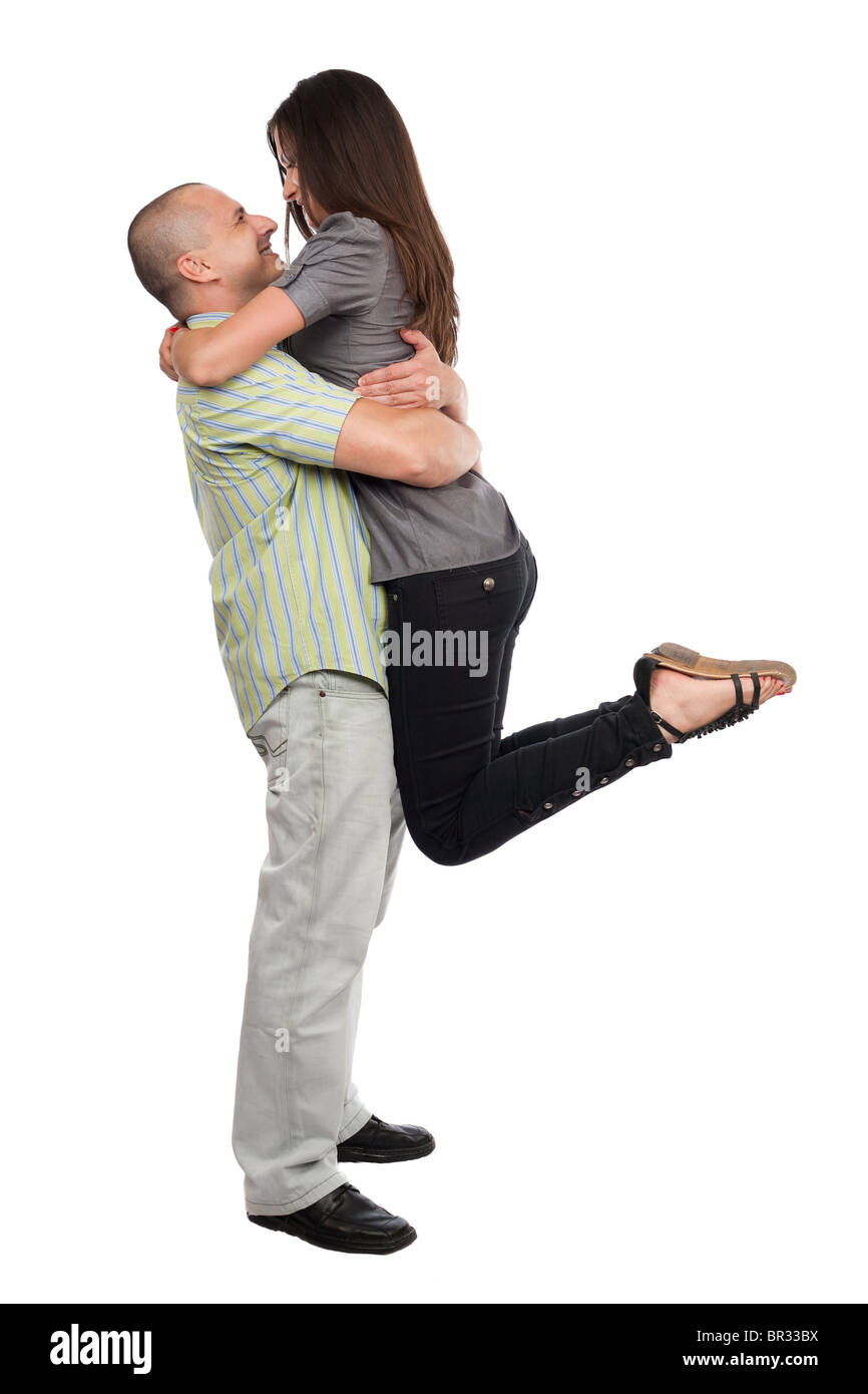 Happy young woman jumping in her man's arms Stock Photo - Alamy