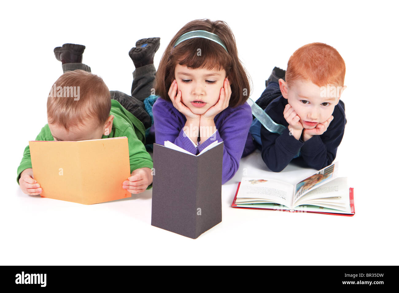 Kids reading books Stock Photo - Alamy