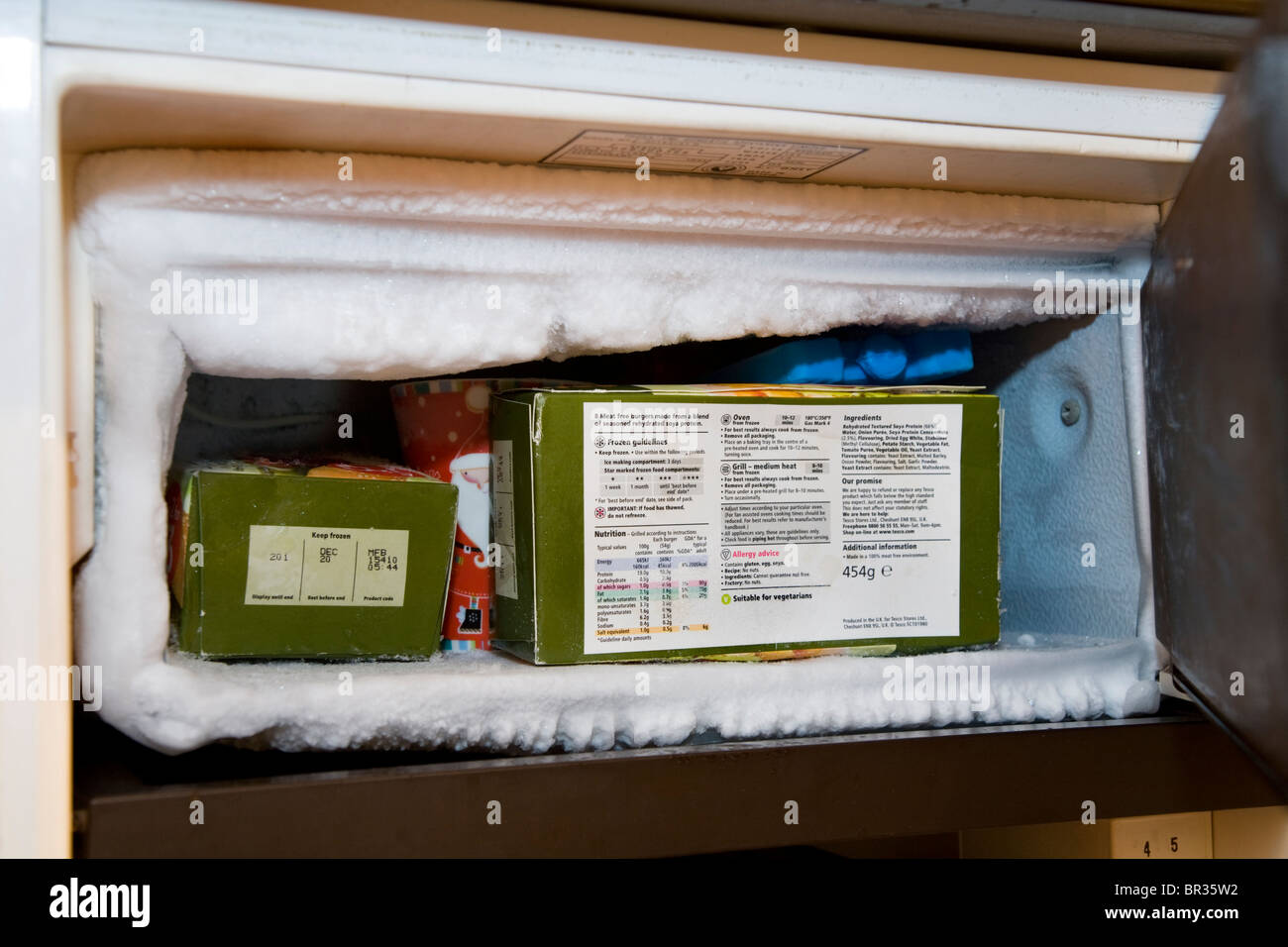 Frozen ice box iced up with thick ice Stock Photo - Alamy
