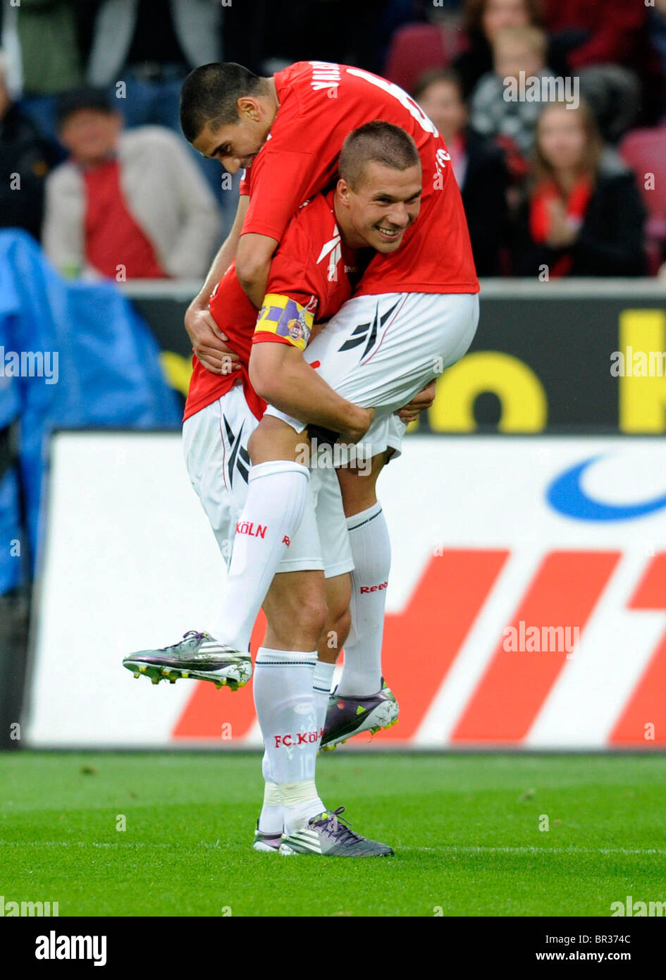 Cologne players Lukas Podolski and Taner Yalcin (from left) are ...