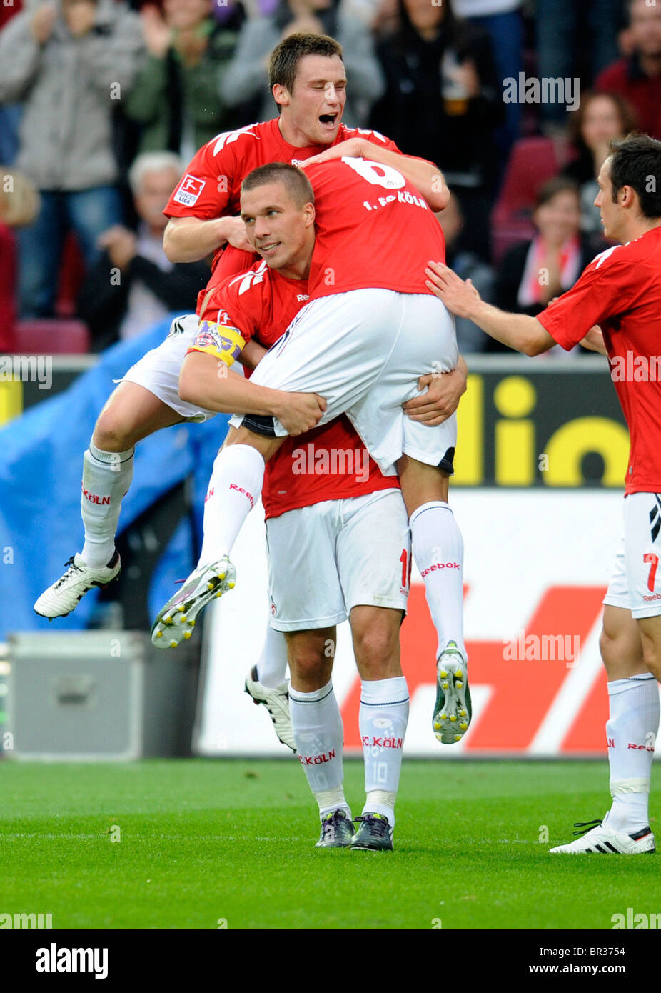 Cologne players Christian Clemens, Lukas Podolski and Taner Yalcin ...
