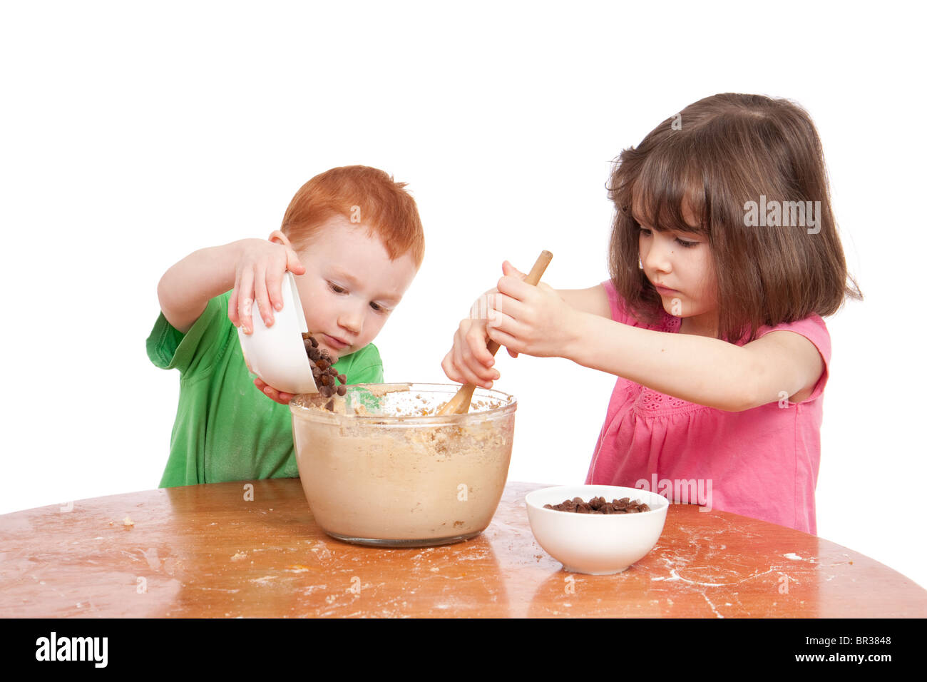 Boy mixing chocolate in kitchen hi-res stock photography and images - Alamy