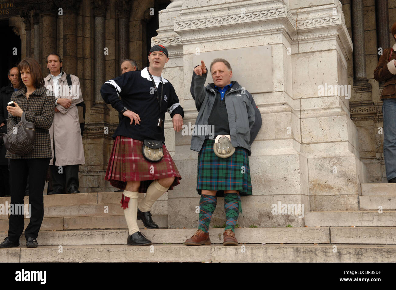 Scotsmen in kilts showing off their legs on the steps of Basilique du ...