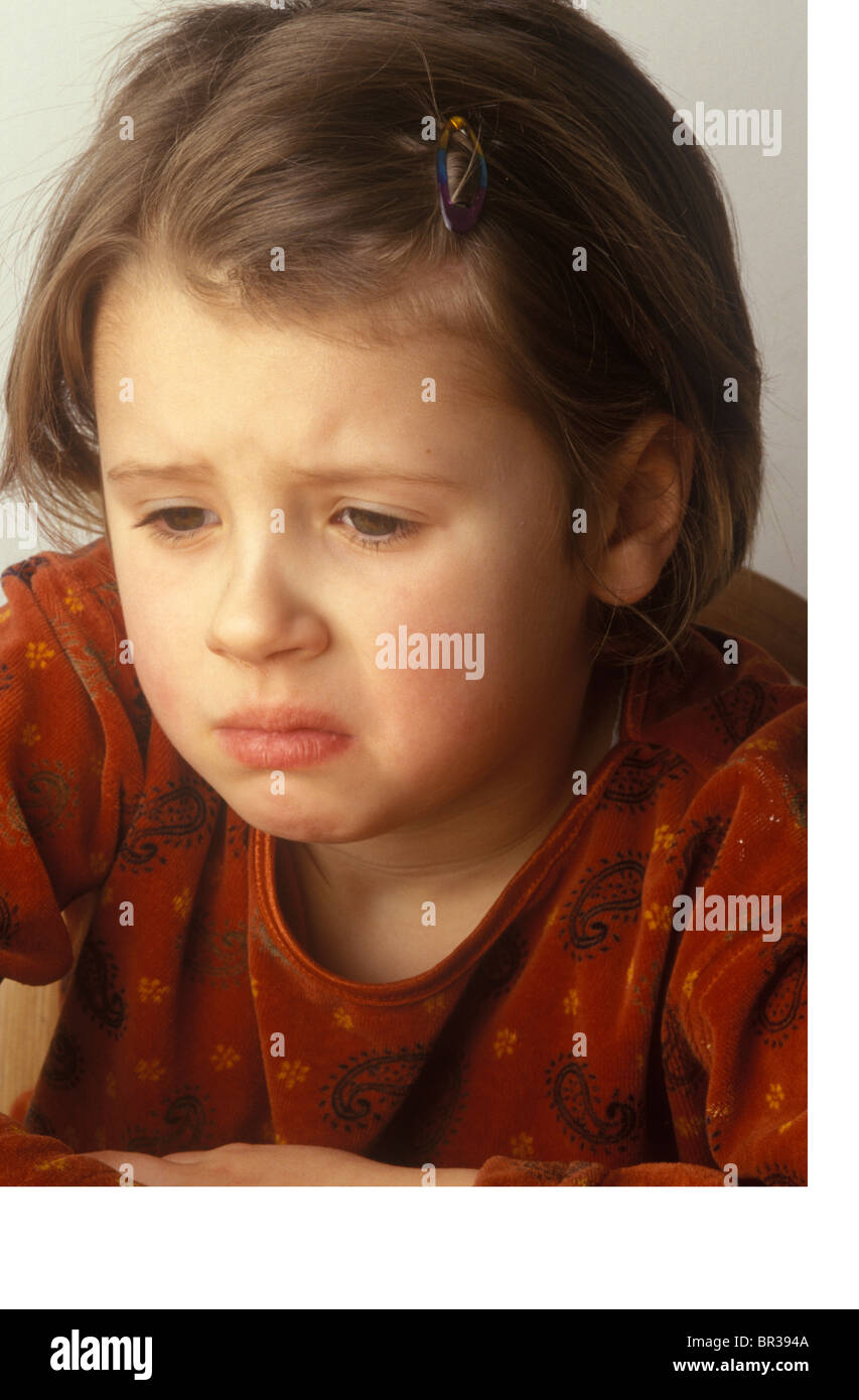 portrait of little girl looking glum Stock Photo - Alamy