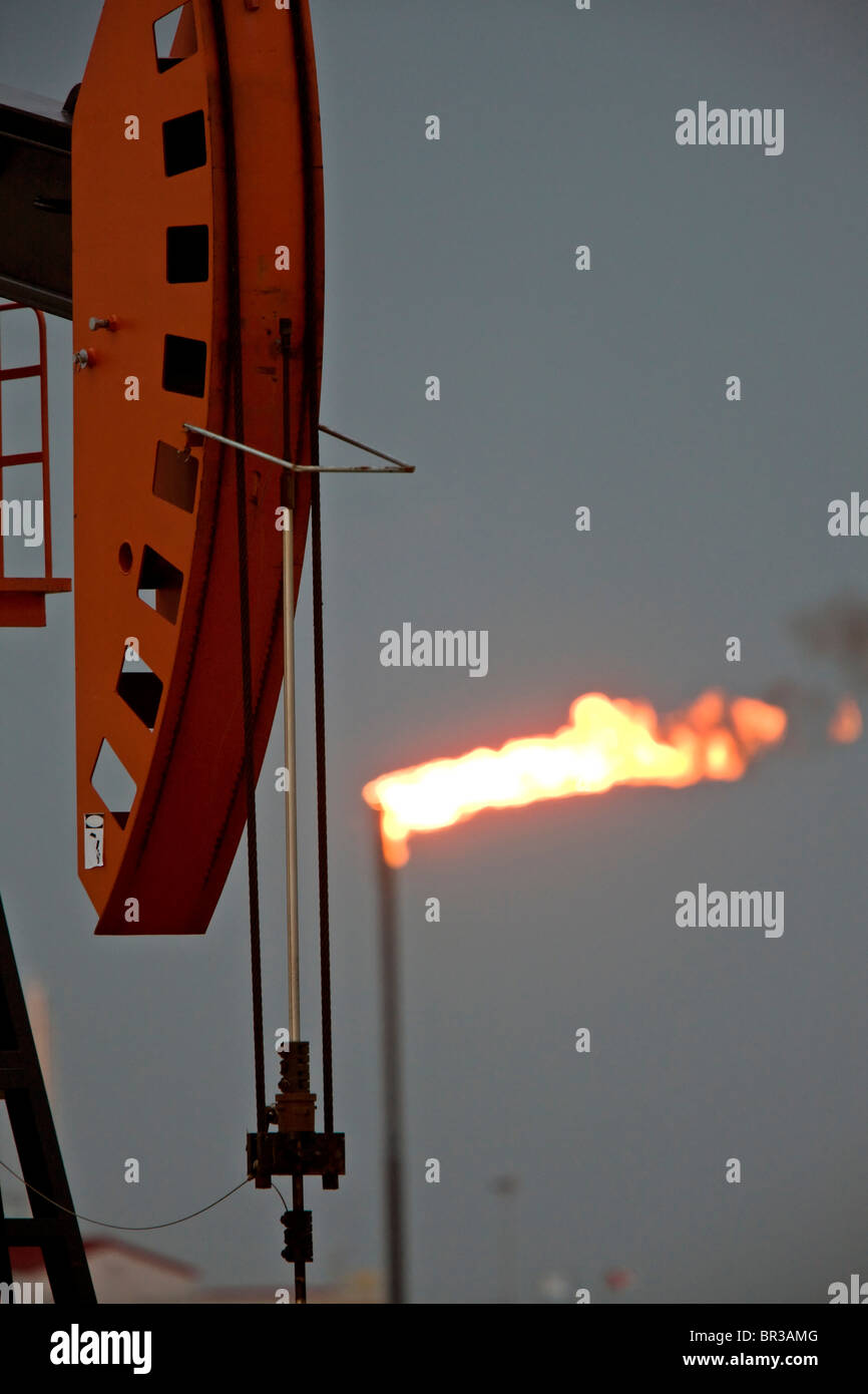 Oil Field flame burn off gas oil jack well pump Stock Photo - Alamy
