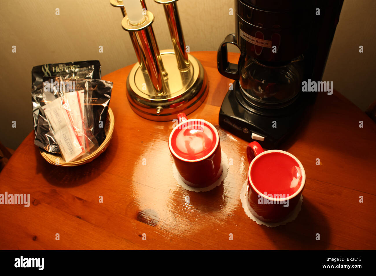 lamp side table coffee mug machine night Stock Photo - Alamy