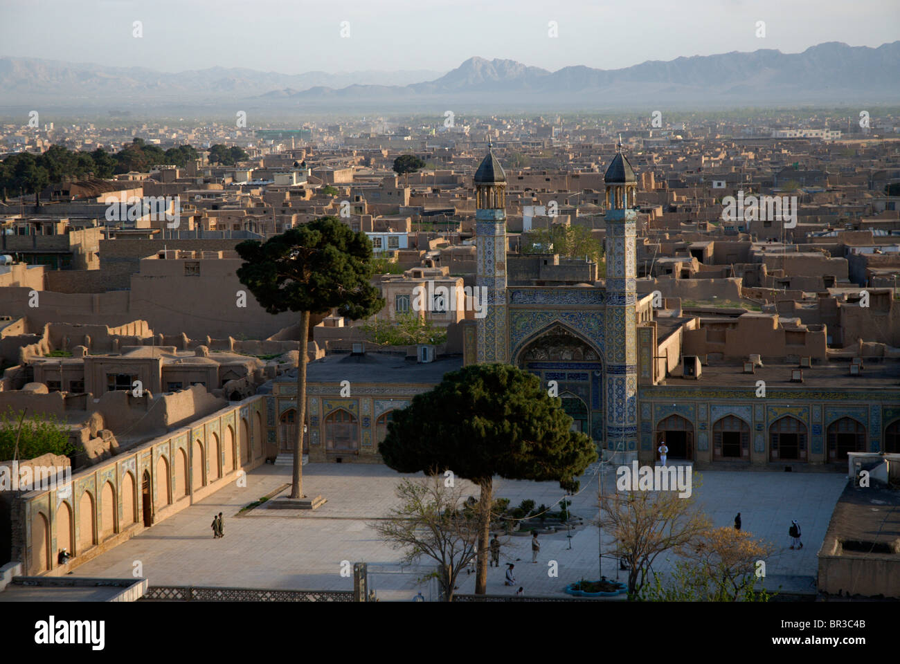The tiled spires of a mosque rise above the low buildings of the old ...