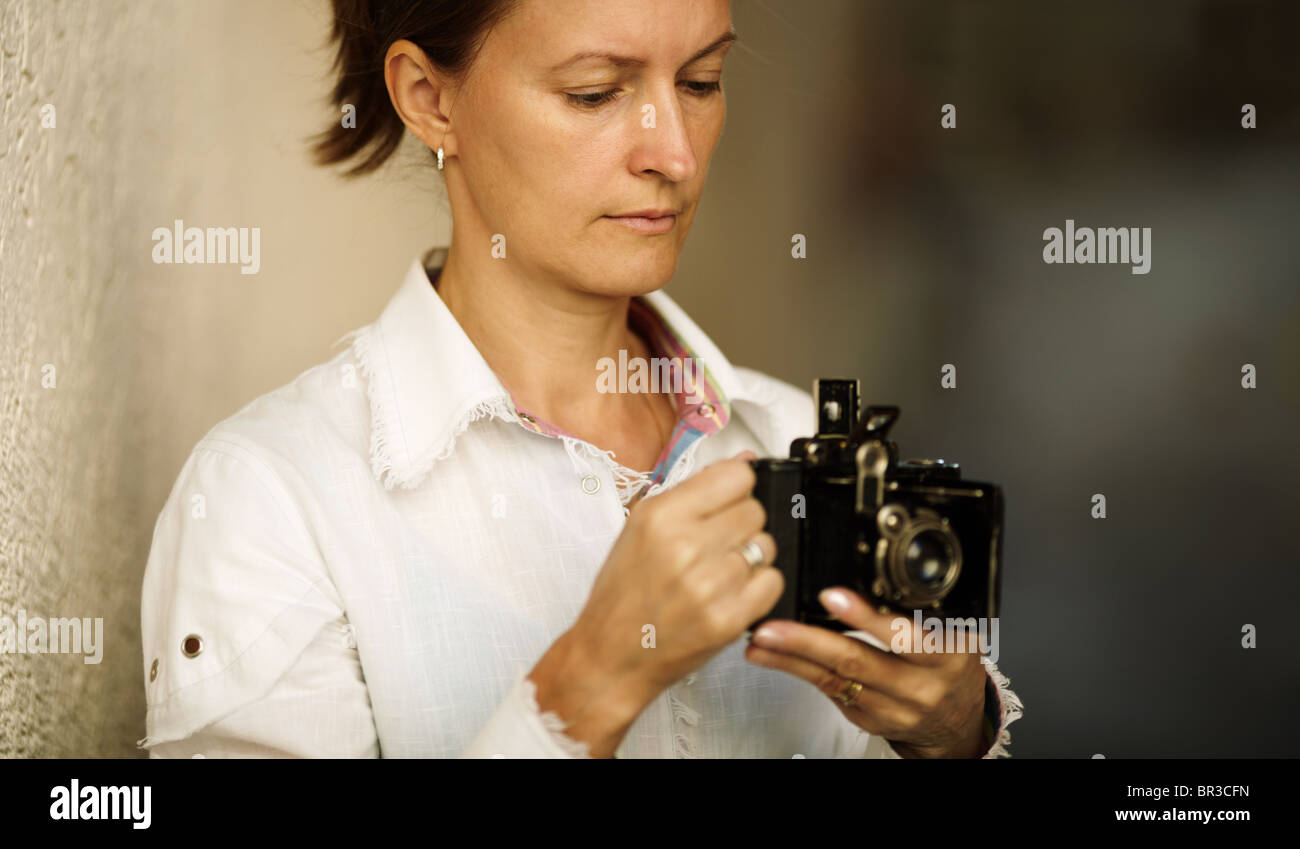 Woman with camera ,focus point on eye Stock Photo - Alamy