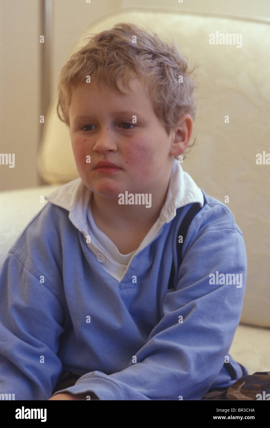 little boy looking sad and miserable with a black eye Stock Photo - Alamy