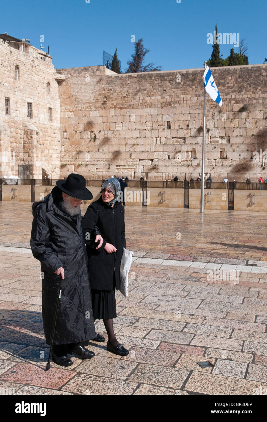 elderly orthodox jew and woman at western wall. Jerusalem Old City ...