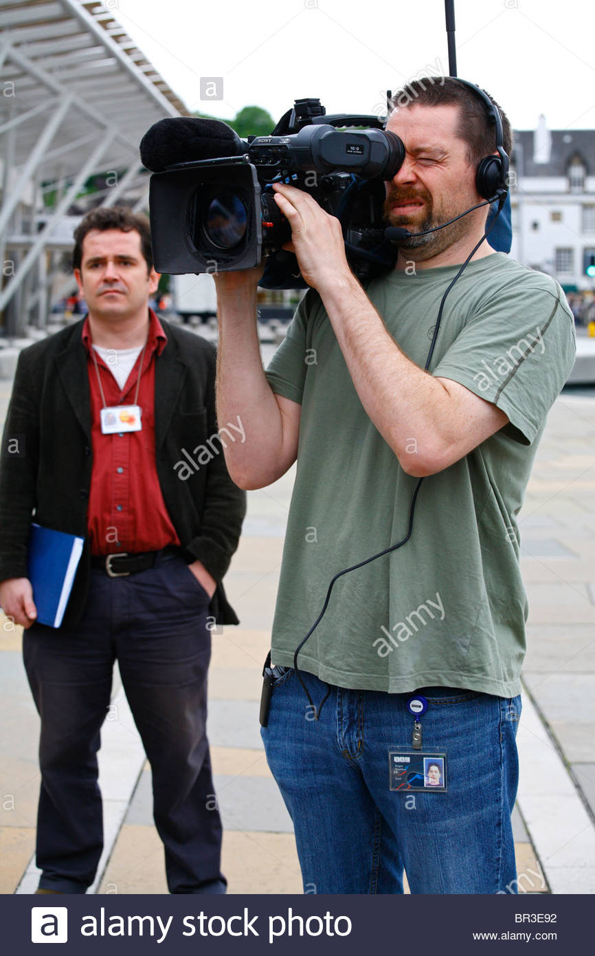 Cameraman filming outside broadcast Stock Photo - Alamy