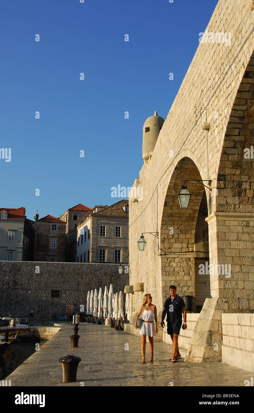 DUBROVNIK, CROATIA. Tourists exploring the old town and harbour early ...