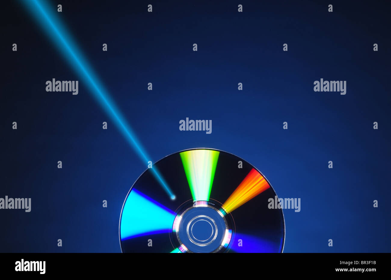 Laser beam puncturing a CD Stock Photo - Alamy