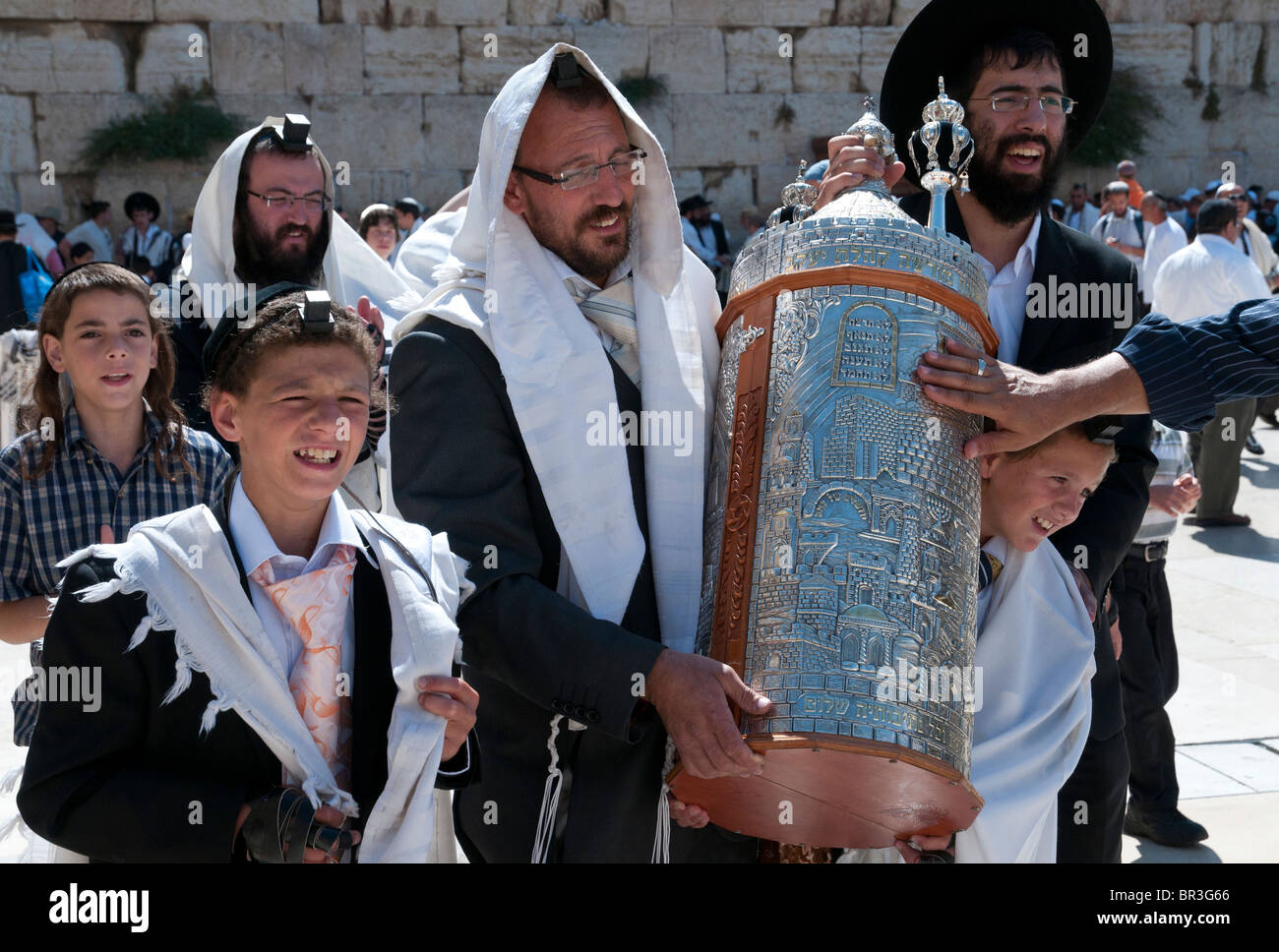 youngster carrying torah scroll during bar mitsva ceremony at western ...