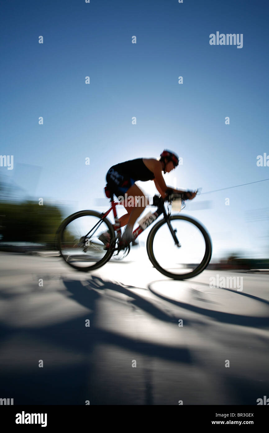 Female triathlete Megan Banks competes in bicycle leg of the first ...