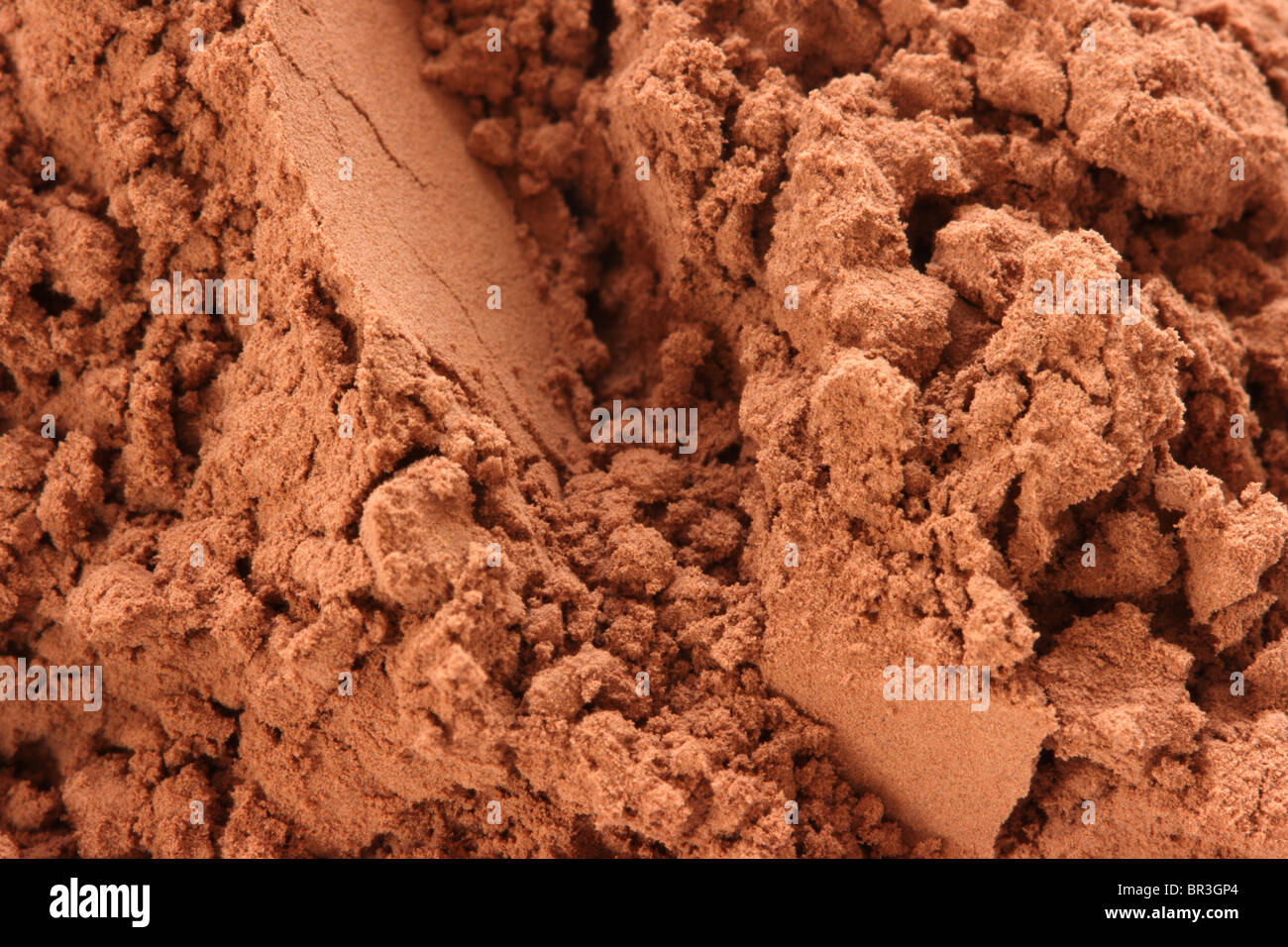 Dark cocoa powder scattered - macro view Stock Photo - Alamy