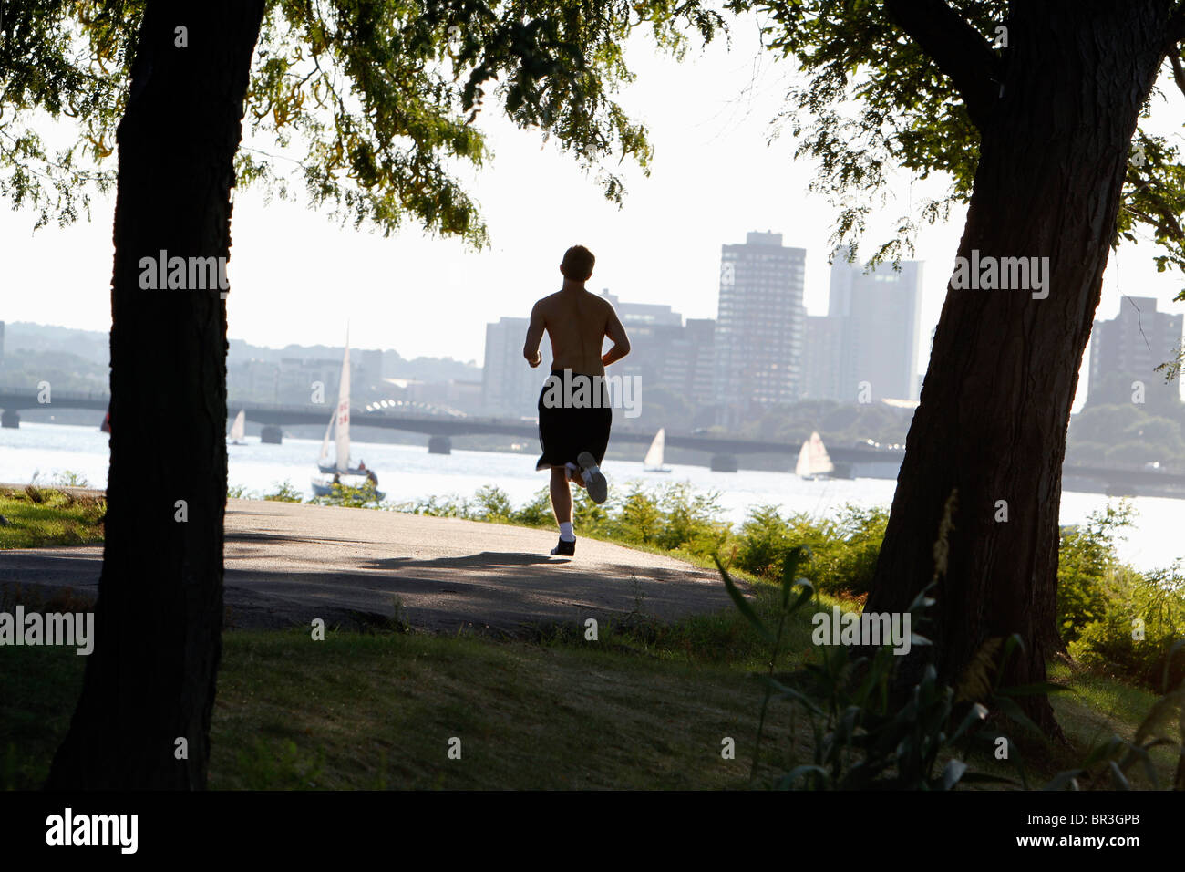 Jogger on the Esplanade along the Charles River in Boston ...
