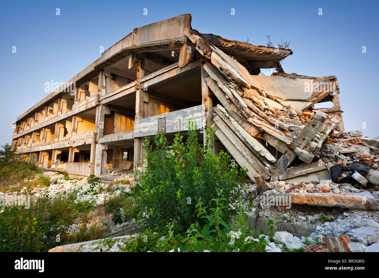 Landscape of ruined buildings at sunset, image of decrepitude or ...