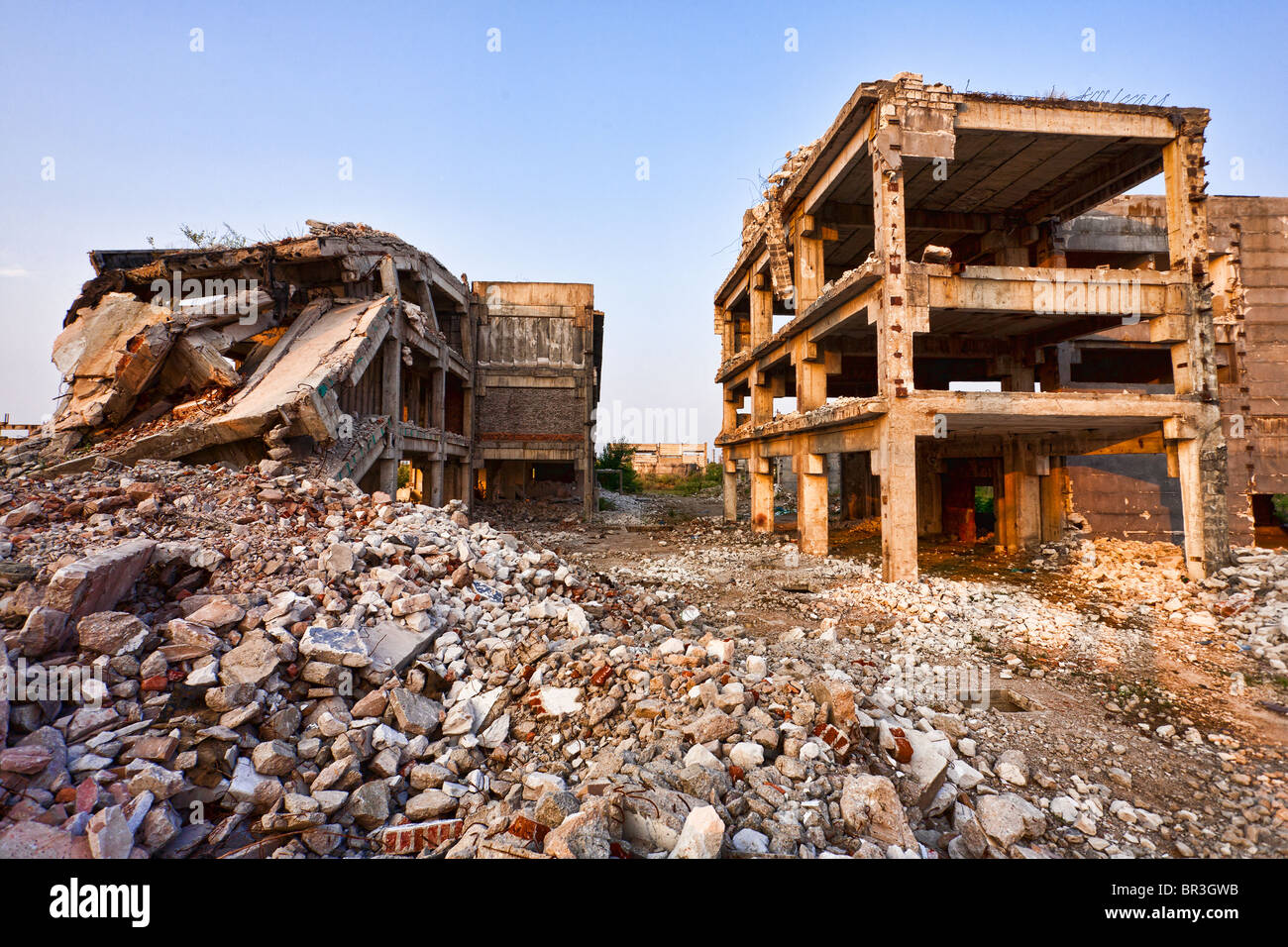 Landscape with ruins of industrial buildings at sunset Stock Photo - Alamy