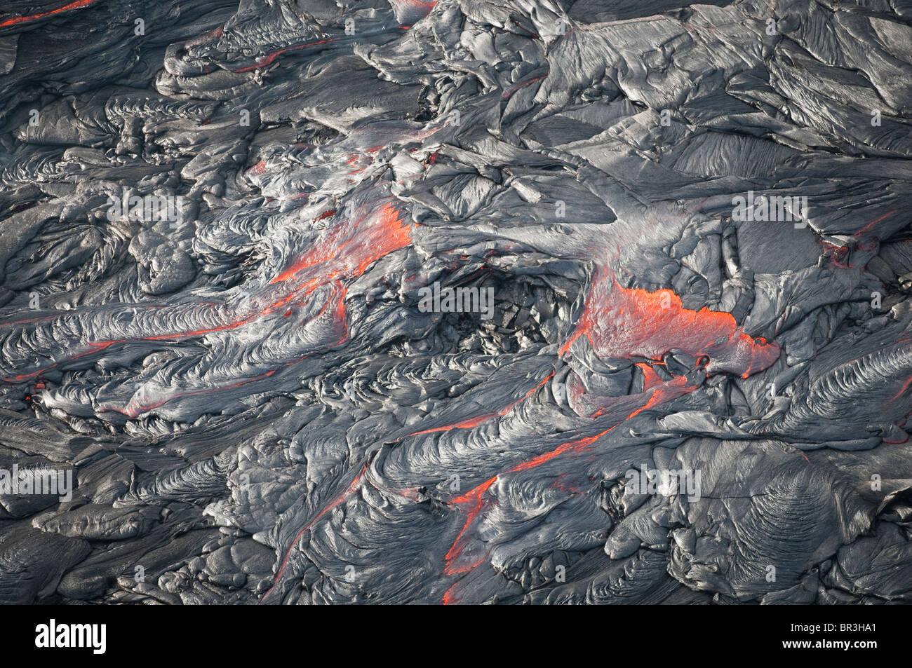 Aerial photograph of lava flowing from PuuOo vent on Hawaii. Located ...