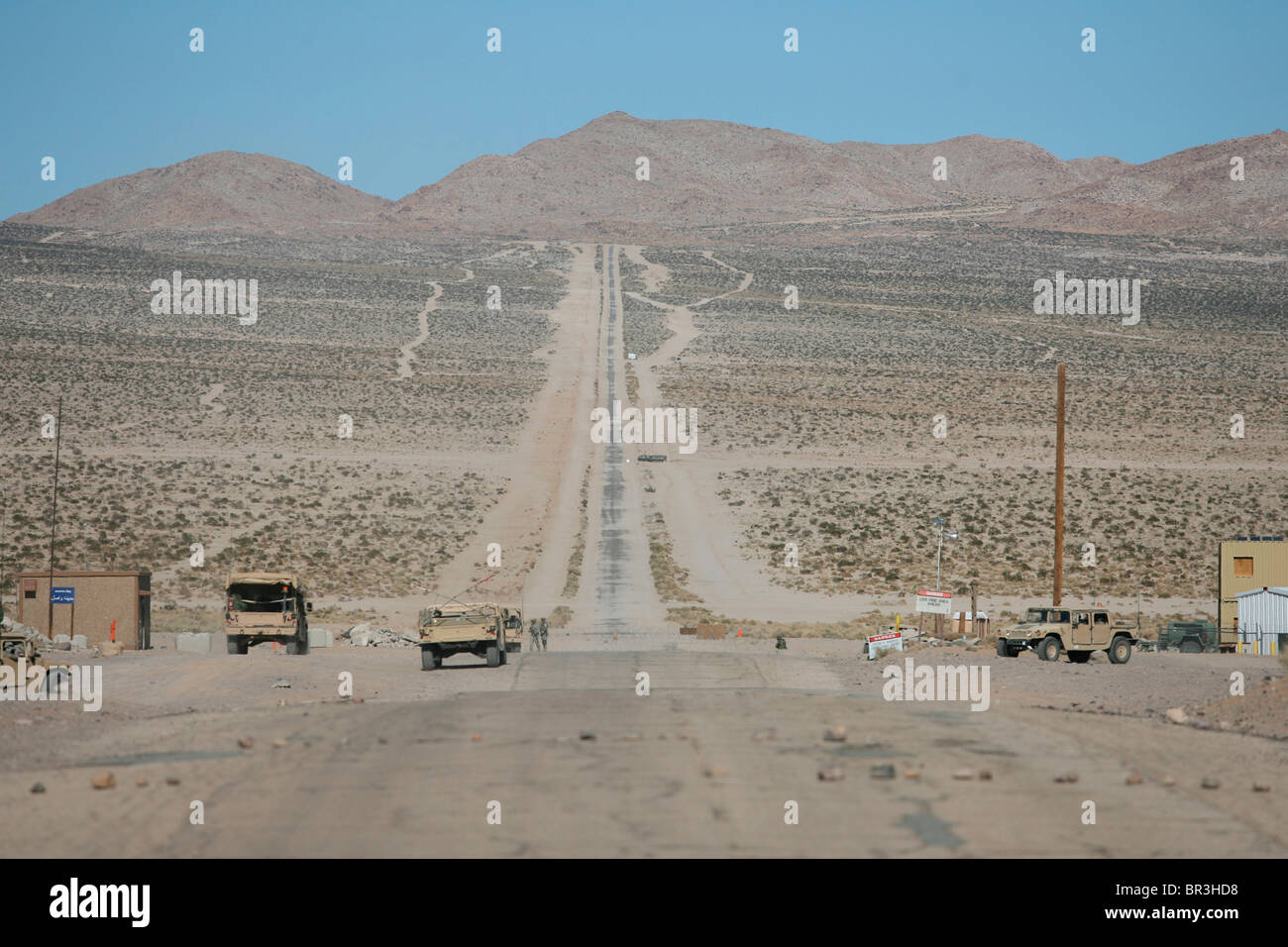 Long dusty road in desert Stock Photo - Alamy