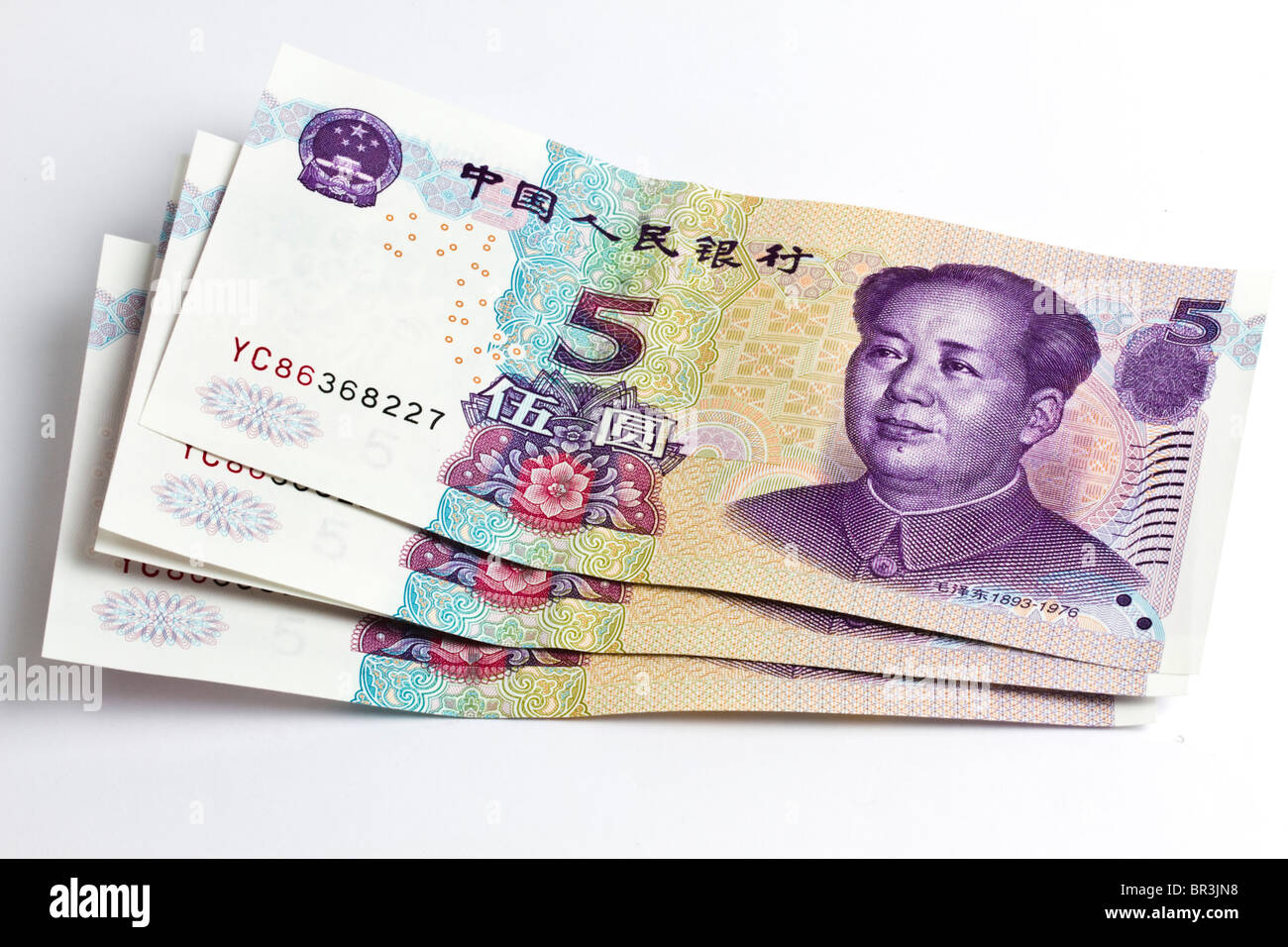 Chinese money isolated on white background Stock Photo - Alamy