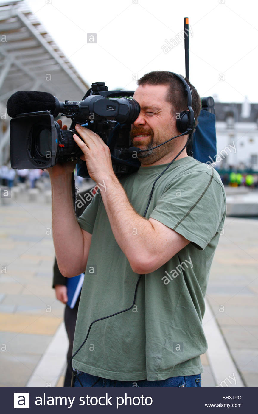 Cameraman filming outside broadcast Stock Photo - Alamy