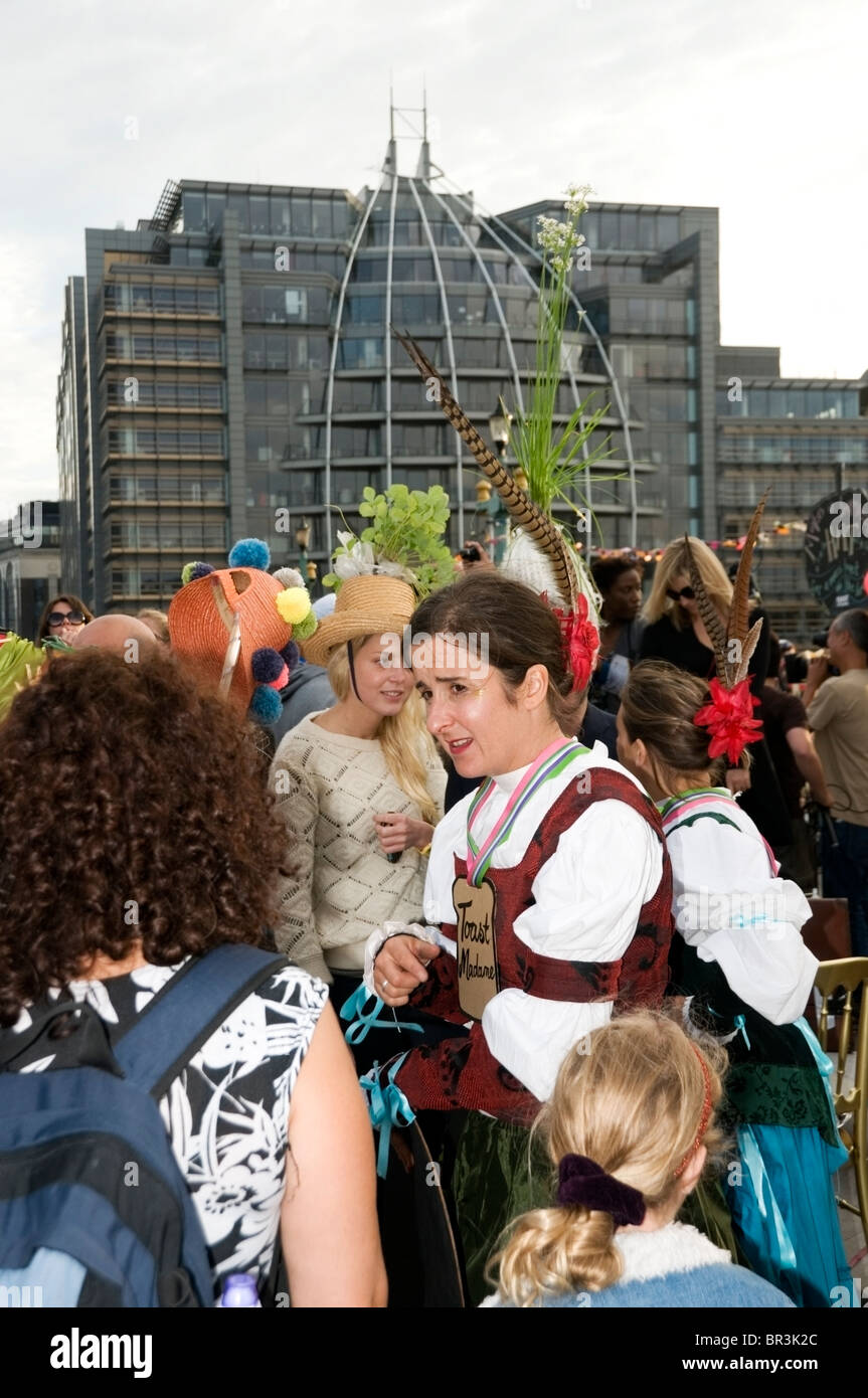 People with hats enjoying the Mayor Thames Festival, Southwark Bridge ...