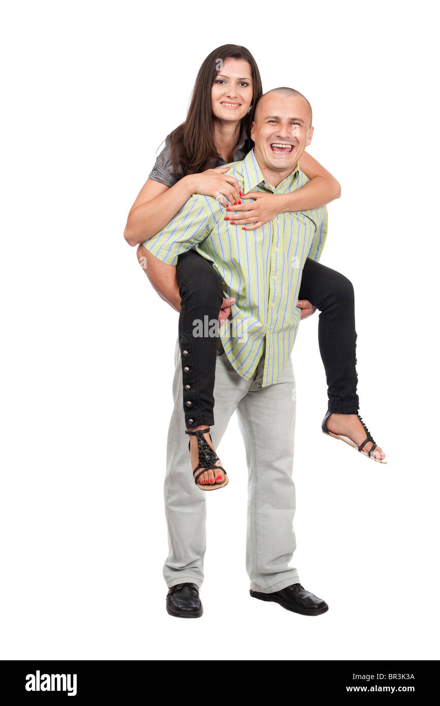 Happy young lady having a piggyback ride on her boyfriend's back Stock ...