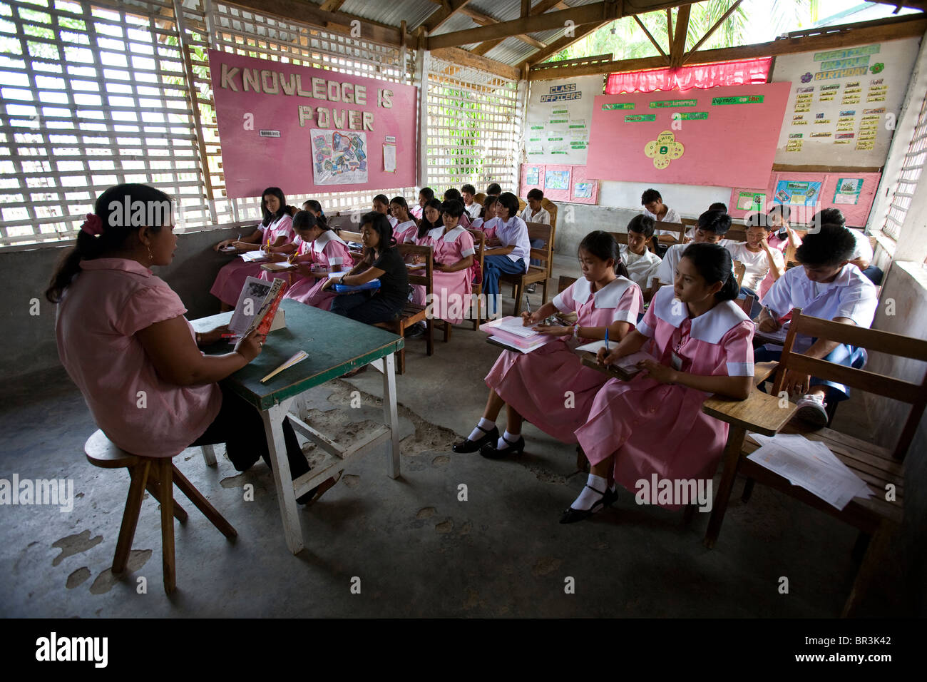 Filipino students in a high school classroom at Penaverde Montessori ...