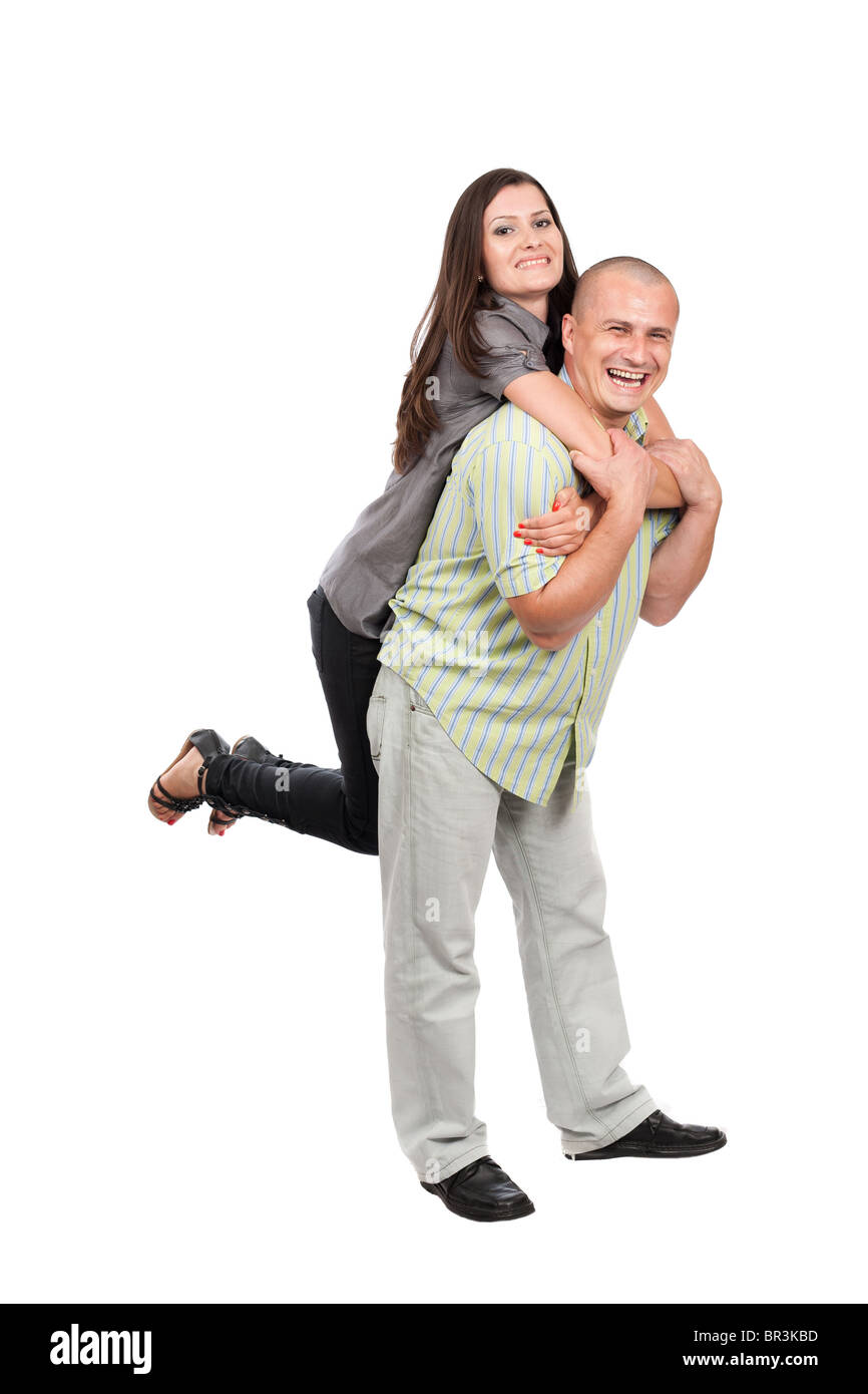 Happy young lady having a piggyback ride on her boyfriend's back Stock ...