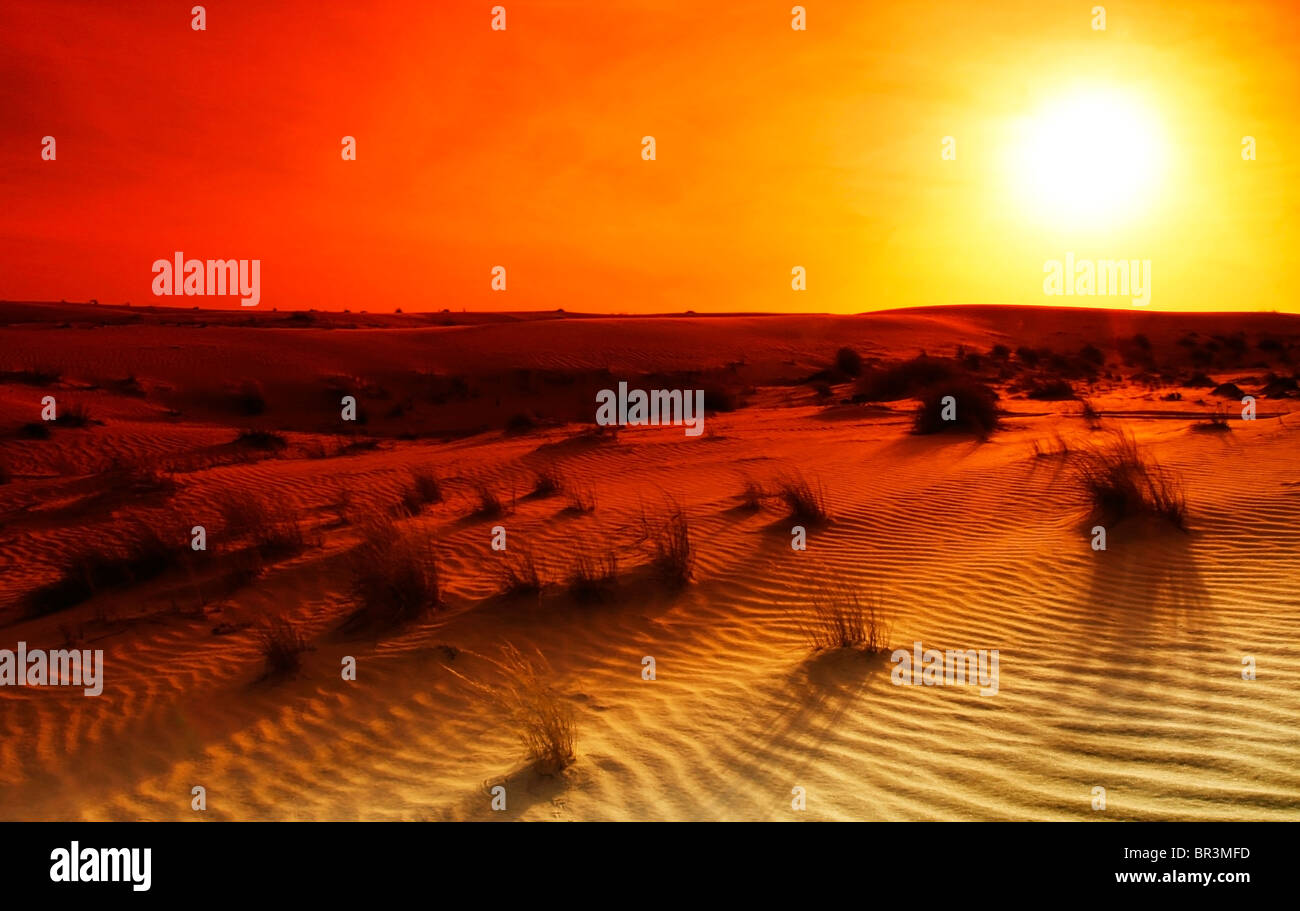 Extreme desert landscape with orange sunset Stock Photo - Alamy