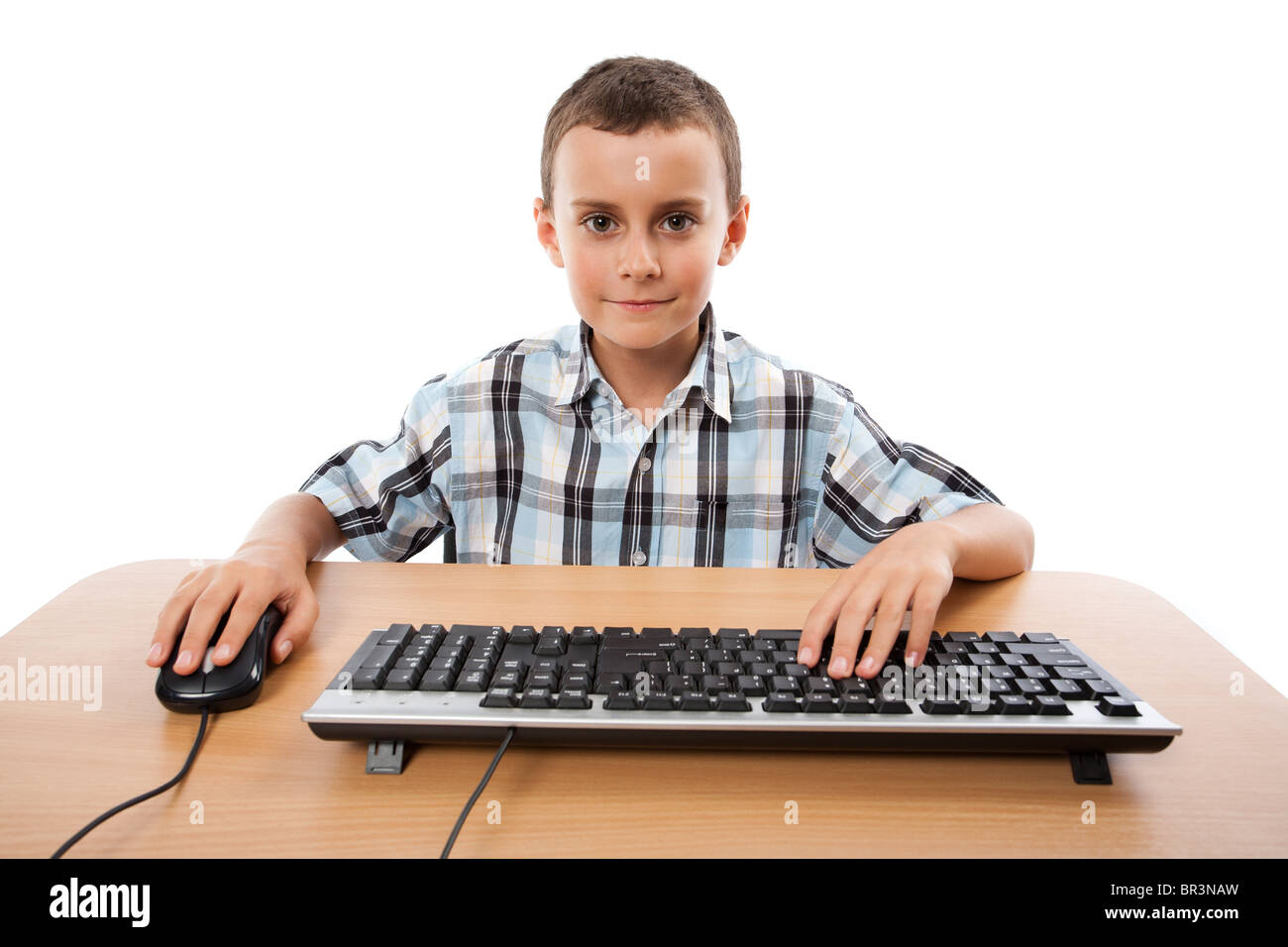 Cute schoolboy using keyboard and mouse, isolated on white background ...