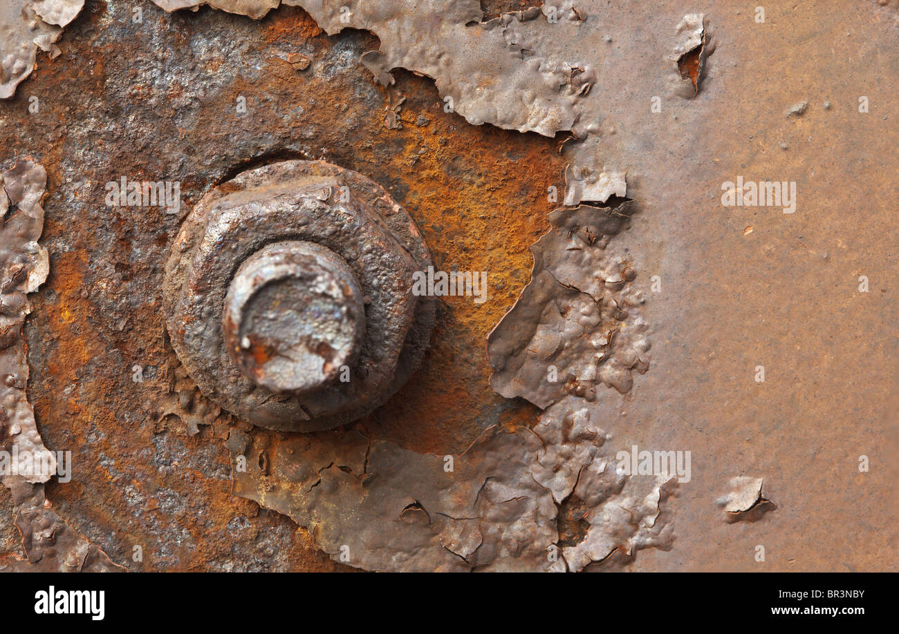 Rusty nut at the surface of steel plate closeup Stock Photo - Alamy