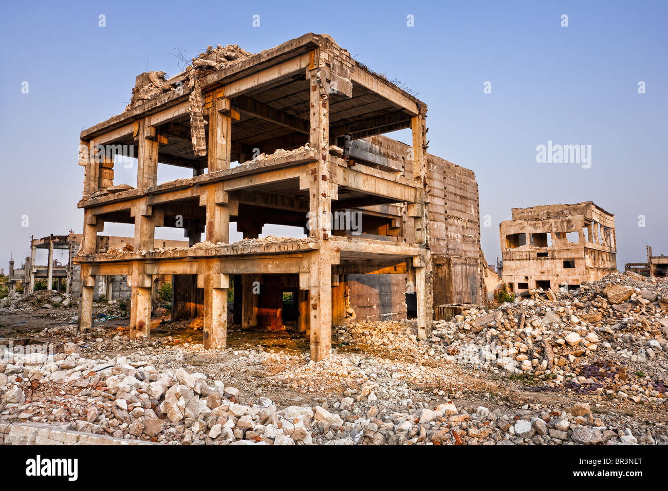 Landscape of ruined buildings at sunset, image of decrepitude or ...