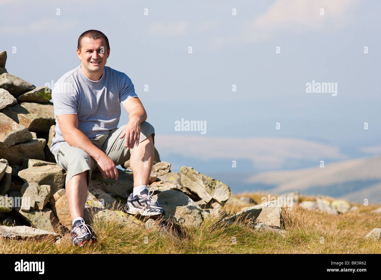 Portrait of a young man outdoor with sky in the background Stock Photo ...
