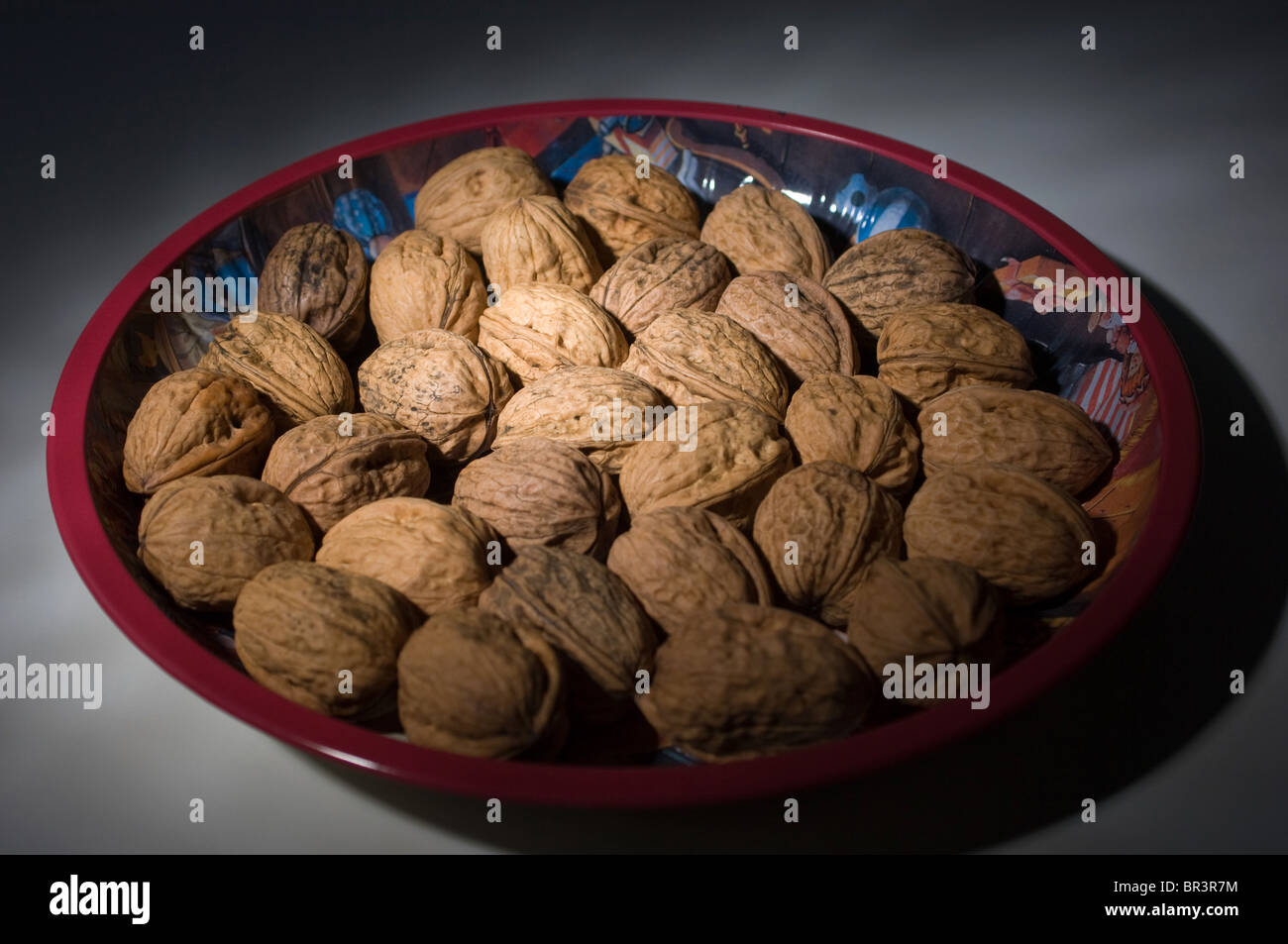 A Christmas plate full of walnuts Stock Photo - Alamy