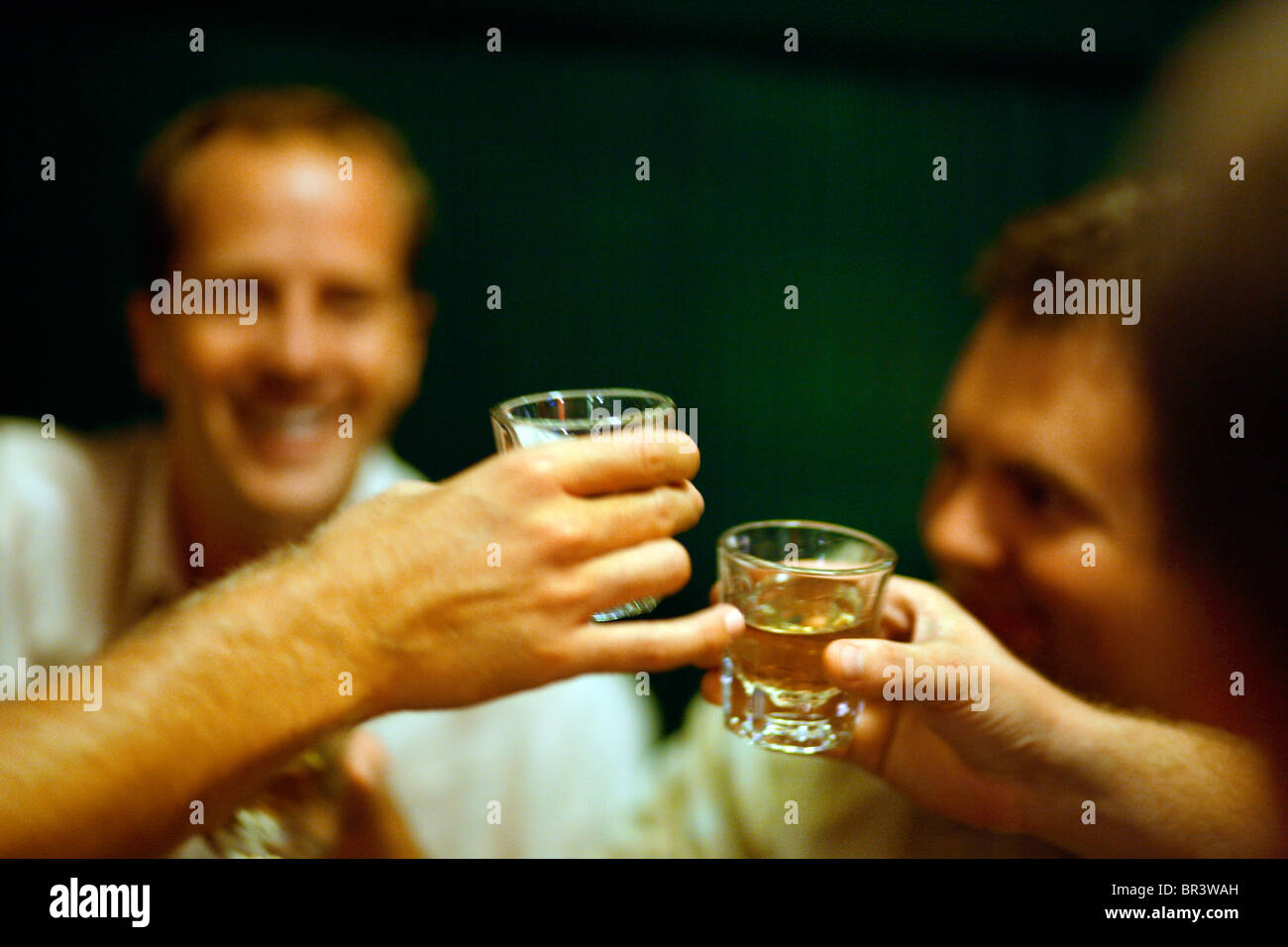 Hands toasting shots hi-res stock photography and images - Alamy