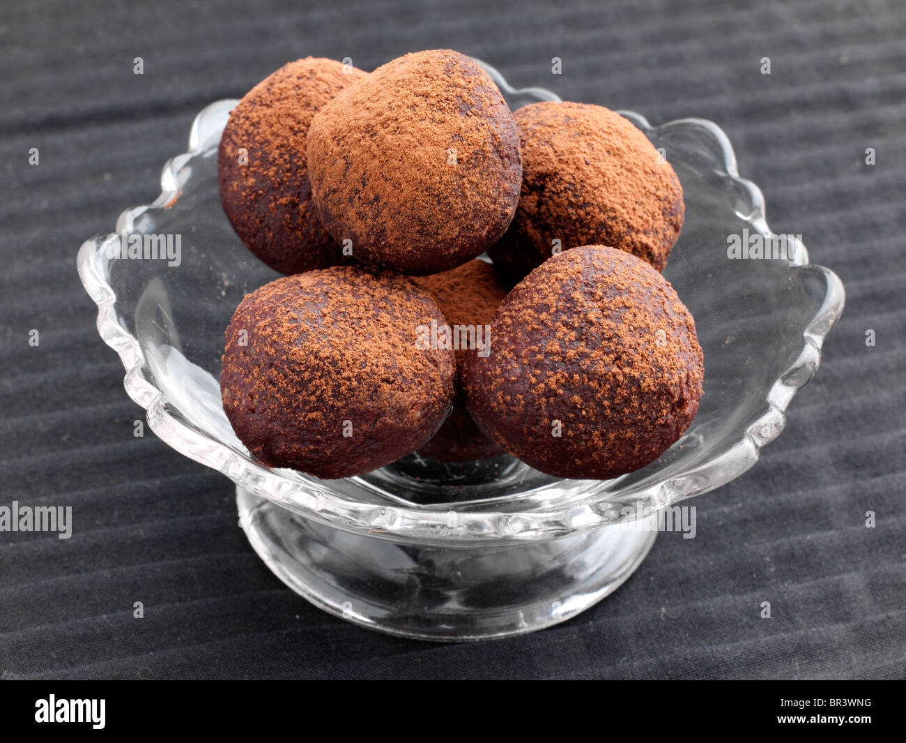 Chocolate truffles dusted with cocoa powder Stock Photo - Alamy