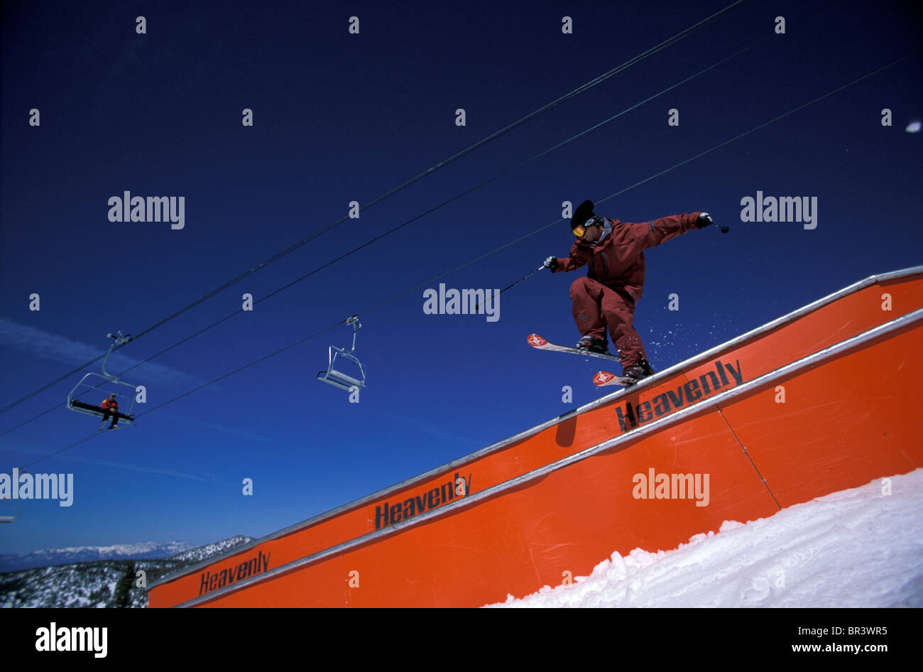 Skier on a rail in a terrain park Stock Photo - Alamy